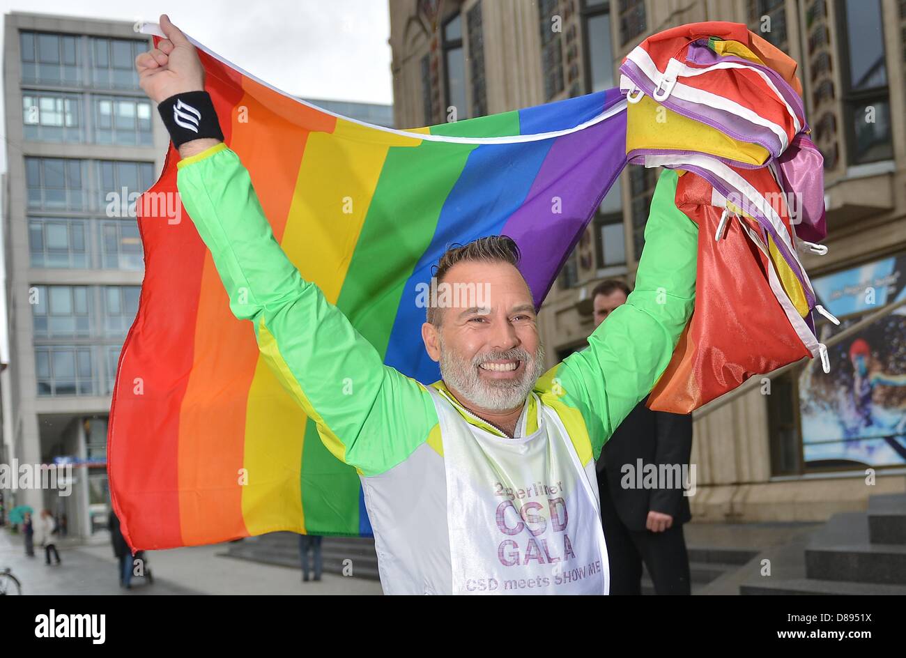 The wedding planner Frank Matthee holds a rainbow flag as he arrives ...