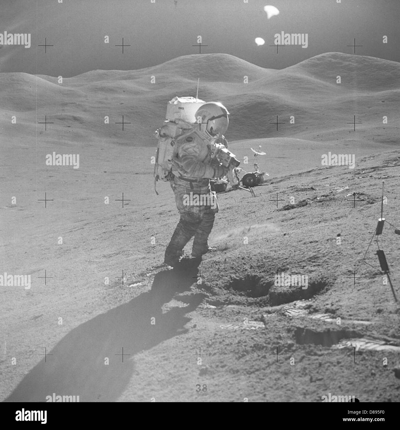 Astronaut David Scott of Apollo 15 stands on the slope of Hadley Delta ...