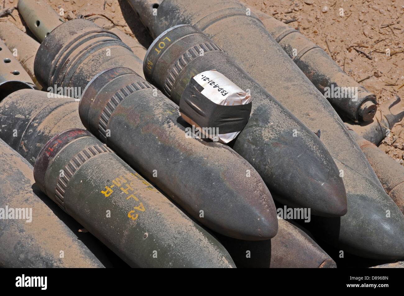 A pile of collected mines, ammunition, and explosives, which are about ...