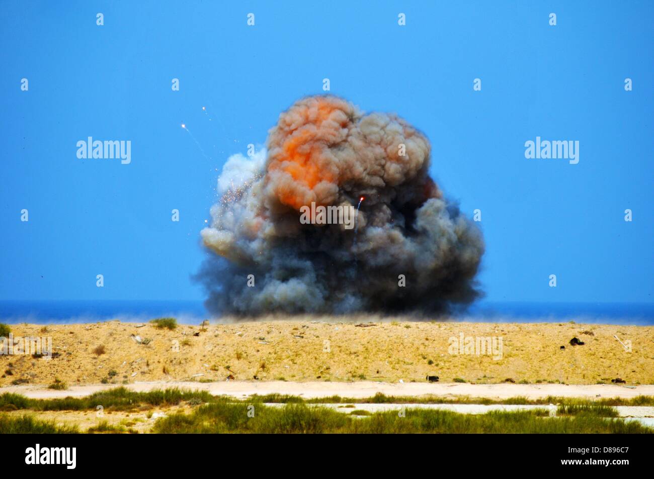 A controlled explosion of ammunition remnants is pictured from a ...
