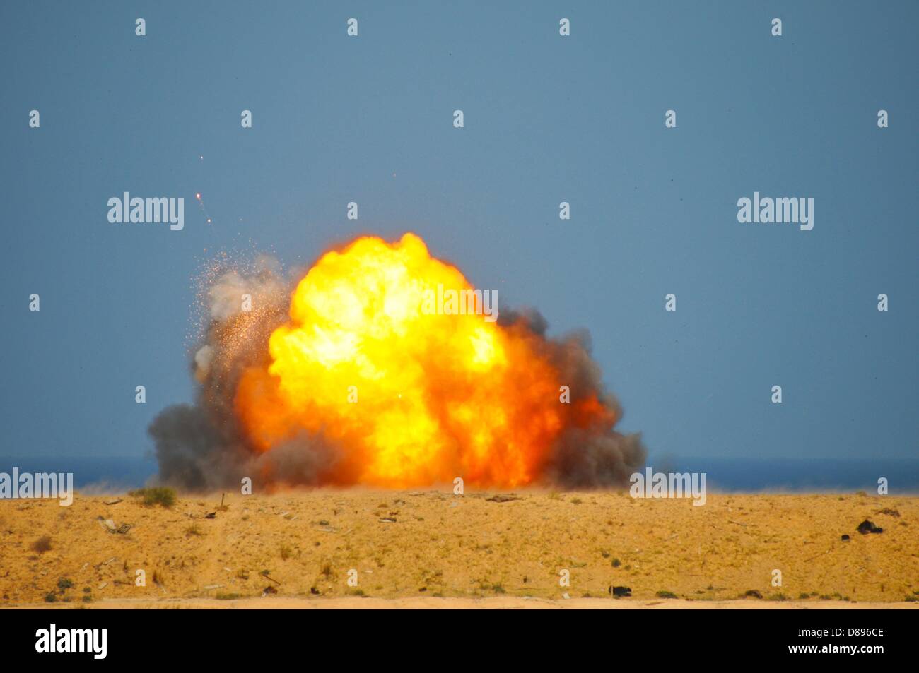 A controlled explosion of ammunition remnants is pictured from a ...