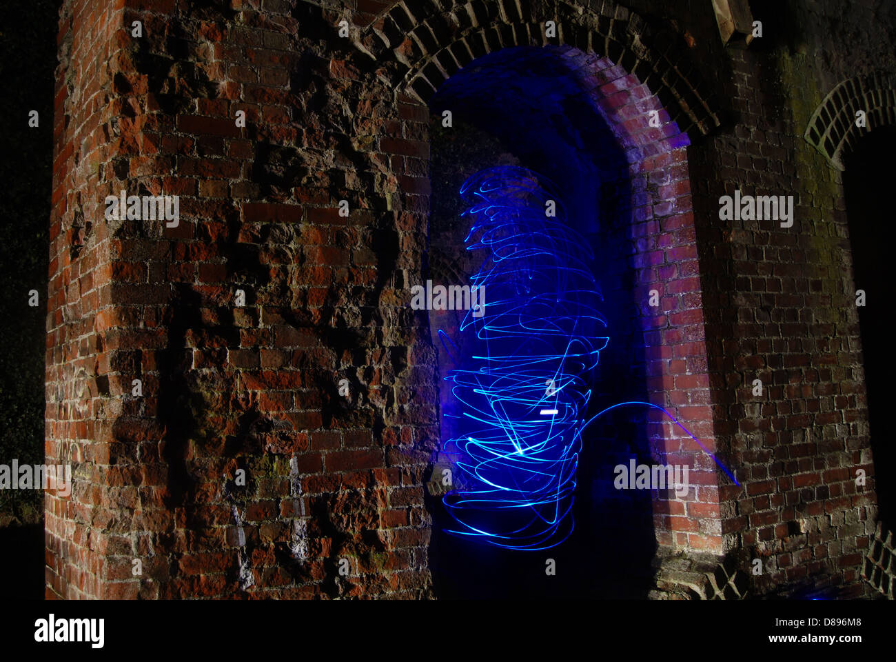 A light trail under an old bridge Stock Photo - Alamy