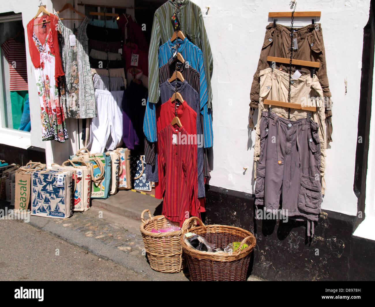 Clothes hanging outside shop in Polperro, Cornwall, UK 2013 Stock Photo ...