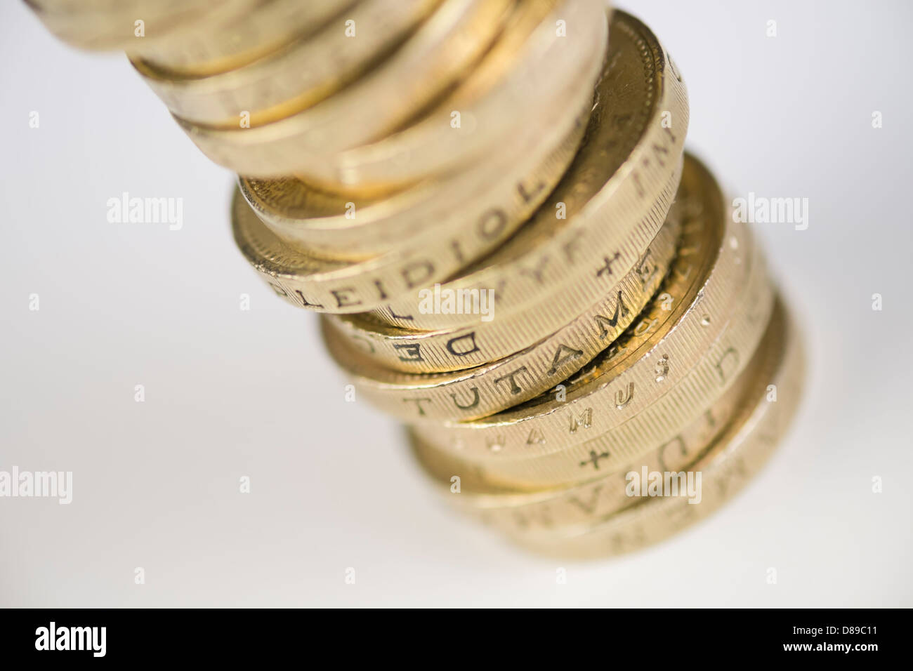 A pile of pound coins on a table Stock Photo - Alamy