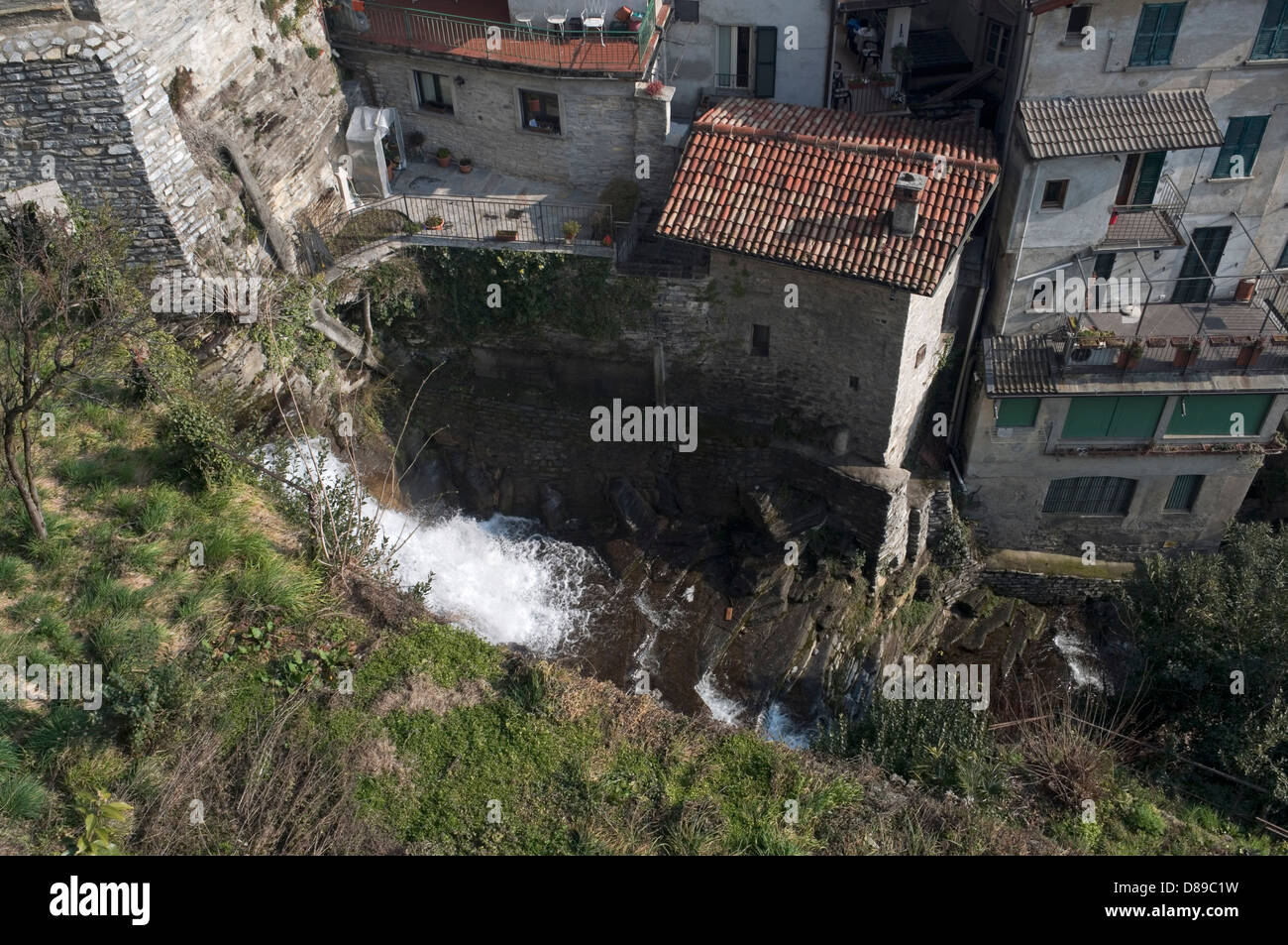 Tumbling waterfall flowing through the village of Moltrasio, Lake Como ...