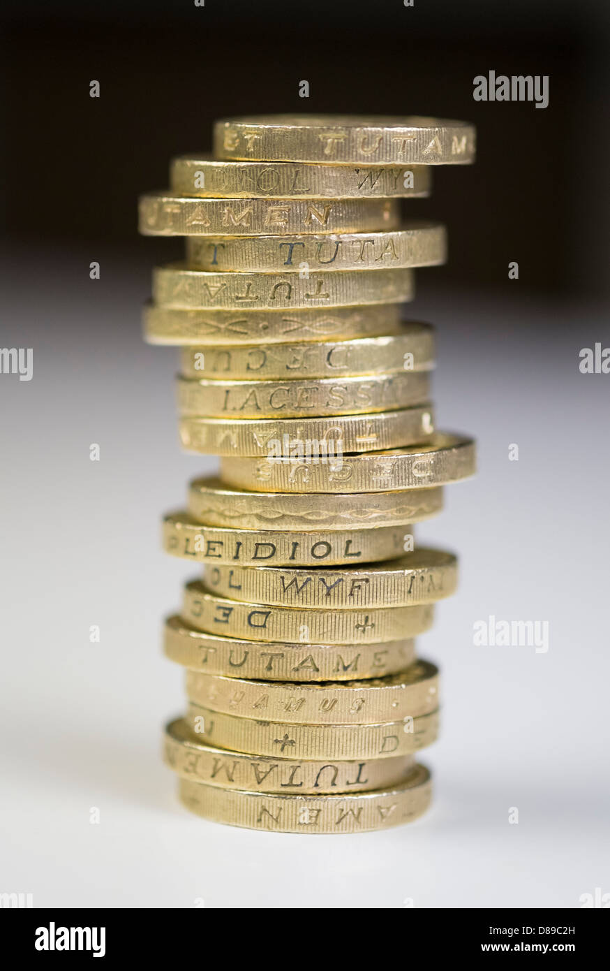 A pile of pound coins on a table Stock Photo - Alamy