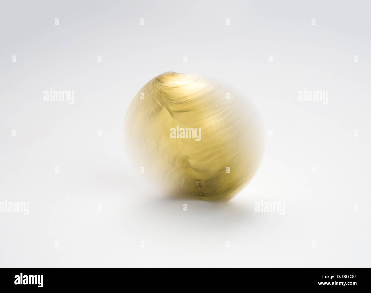 A spinning British pound coin Stock Photo - Alamy