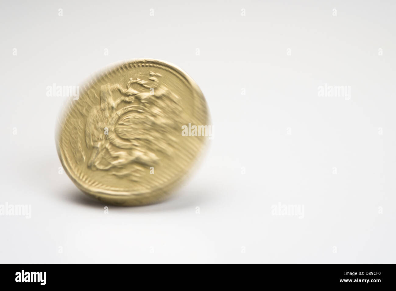 A spinning pound coin Stock Photo - Alamy