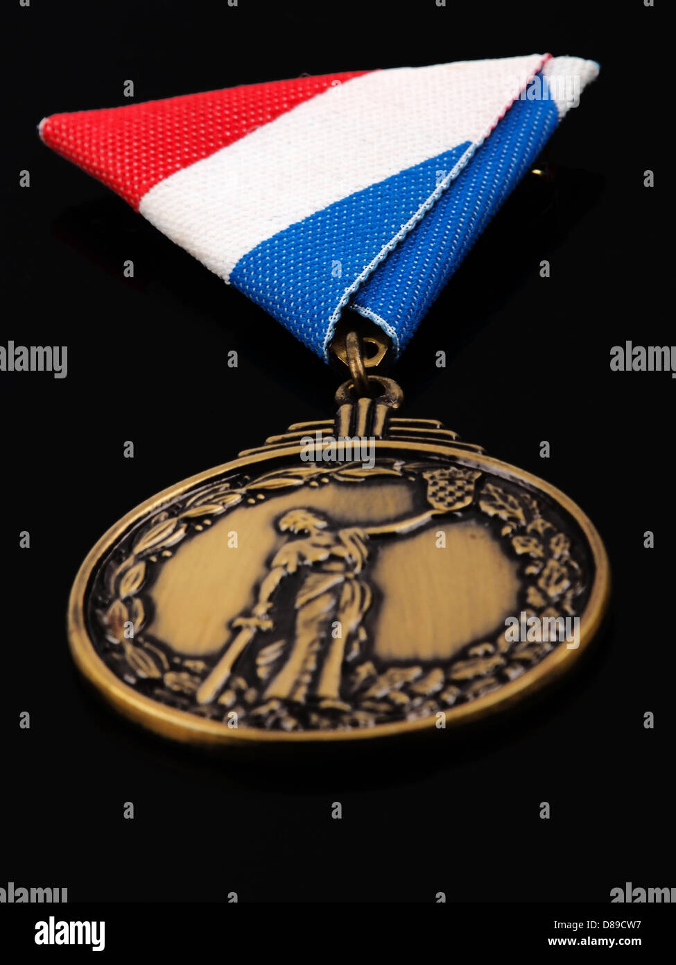 bronze medal for war heroes; isolated on black background Stock Photo ...