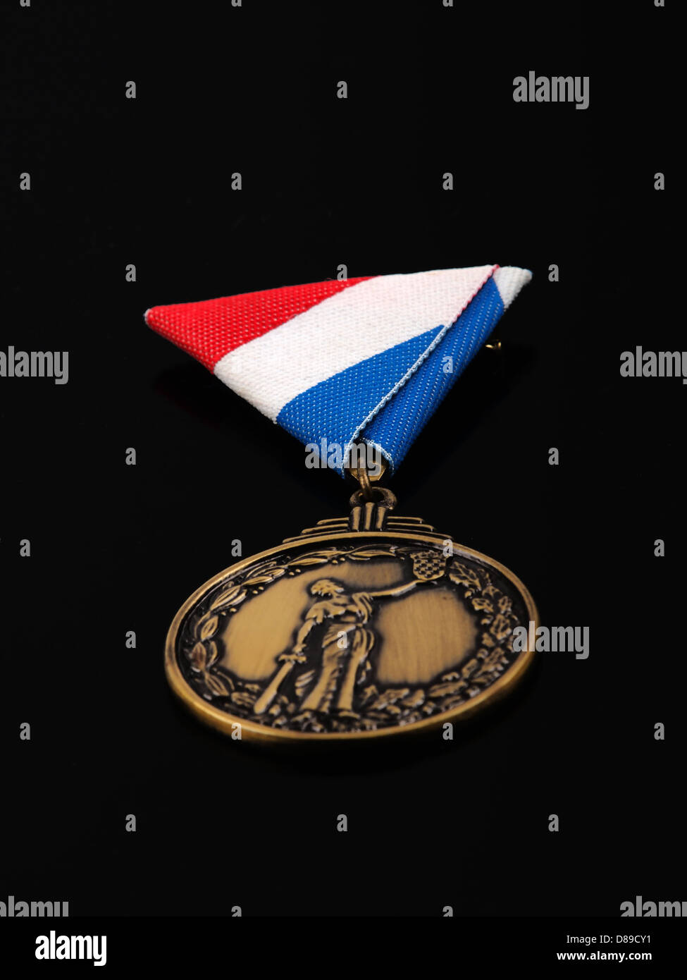 bronze medal for war heroes; isolated on black background Stock Photo ...