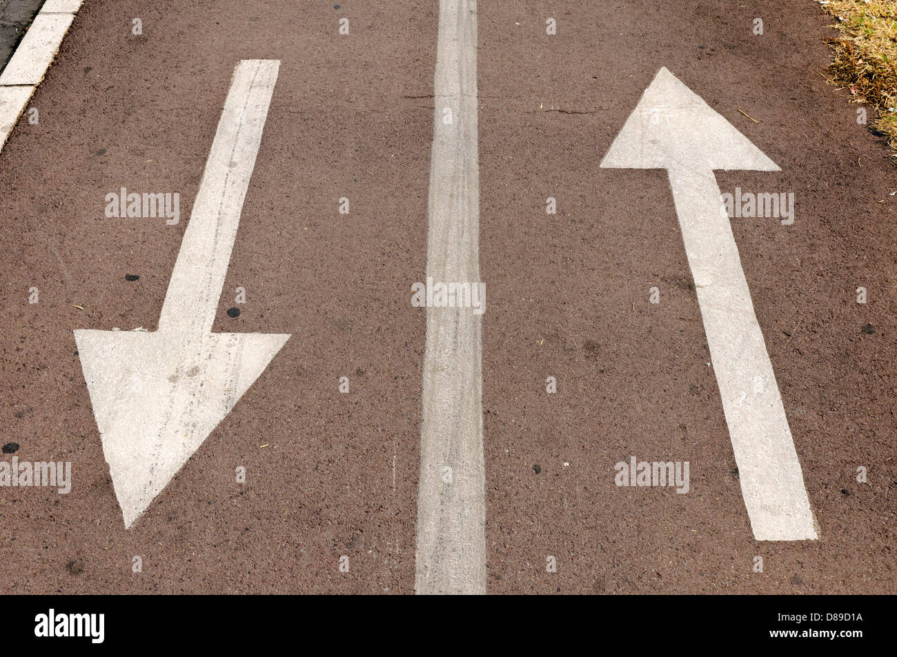 Arrows sign on the road Stock Photo - Alamy
