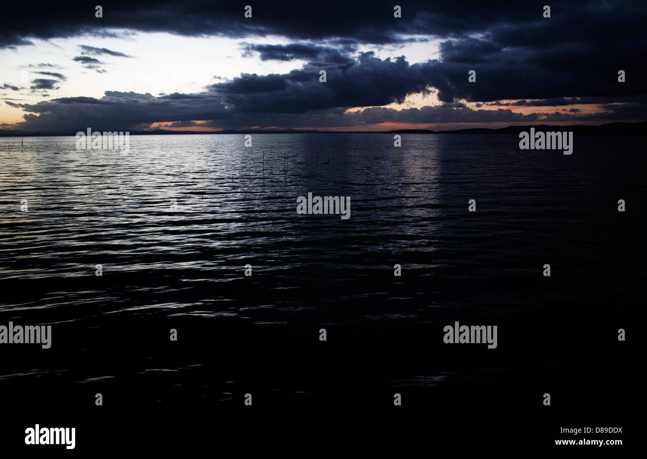 Dark sunset on Trasimeno Lake from Torricella Stock Photo - Alamy