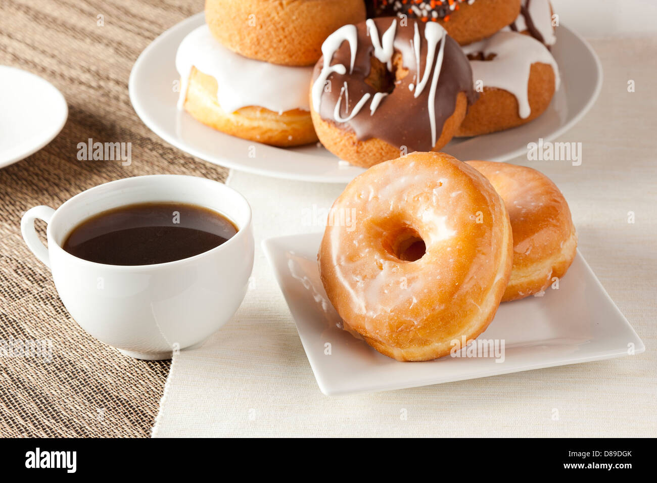Fresh Homemade Donuts and Coffee against a background Stock Photo - Alamy