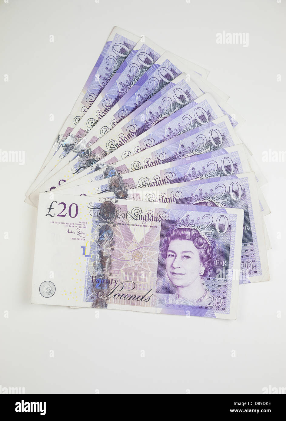 Twenty pound notes in a fan shape on a table Stock Photo - Alamy