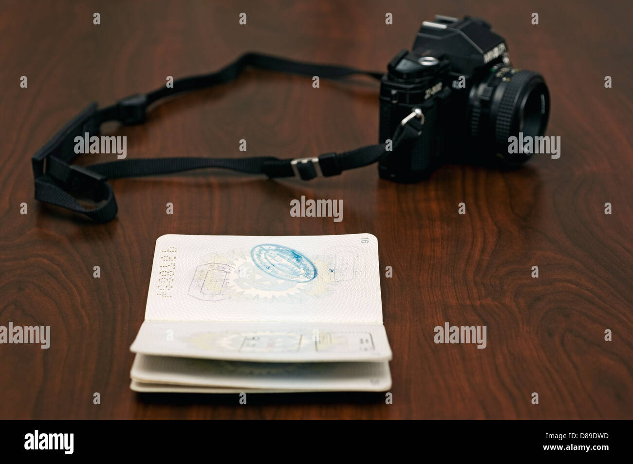 Passport and camera Stock Photo - Alamy