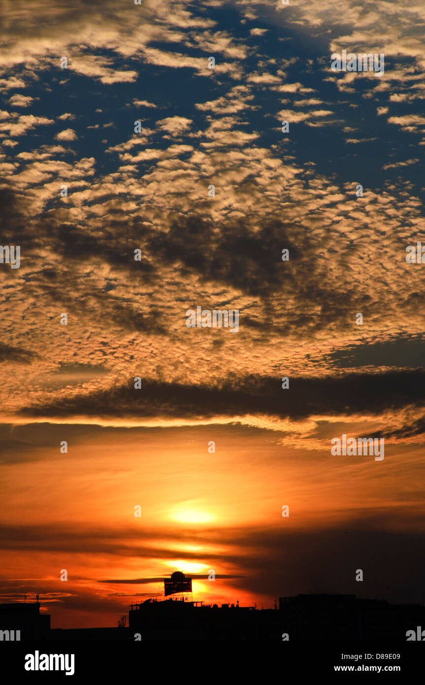 Sunset over the roofs Stock Photo - Alamy
