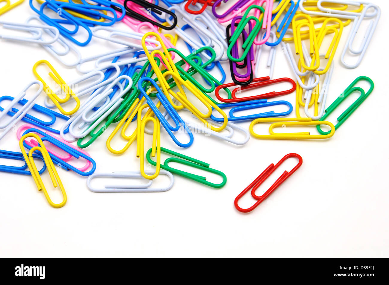 Paper clips on white Stock Photo - Alamy
