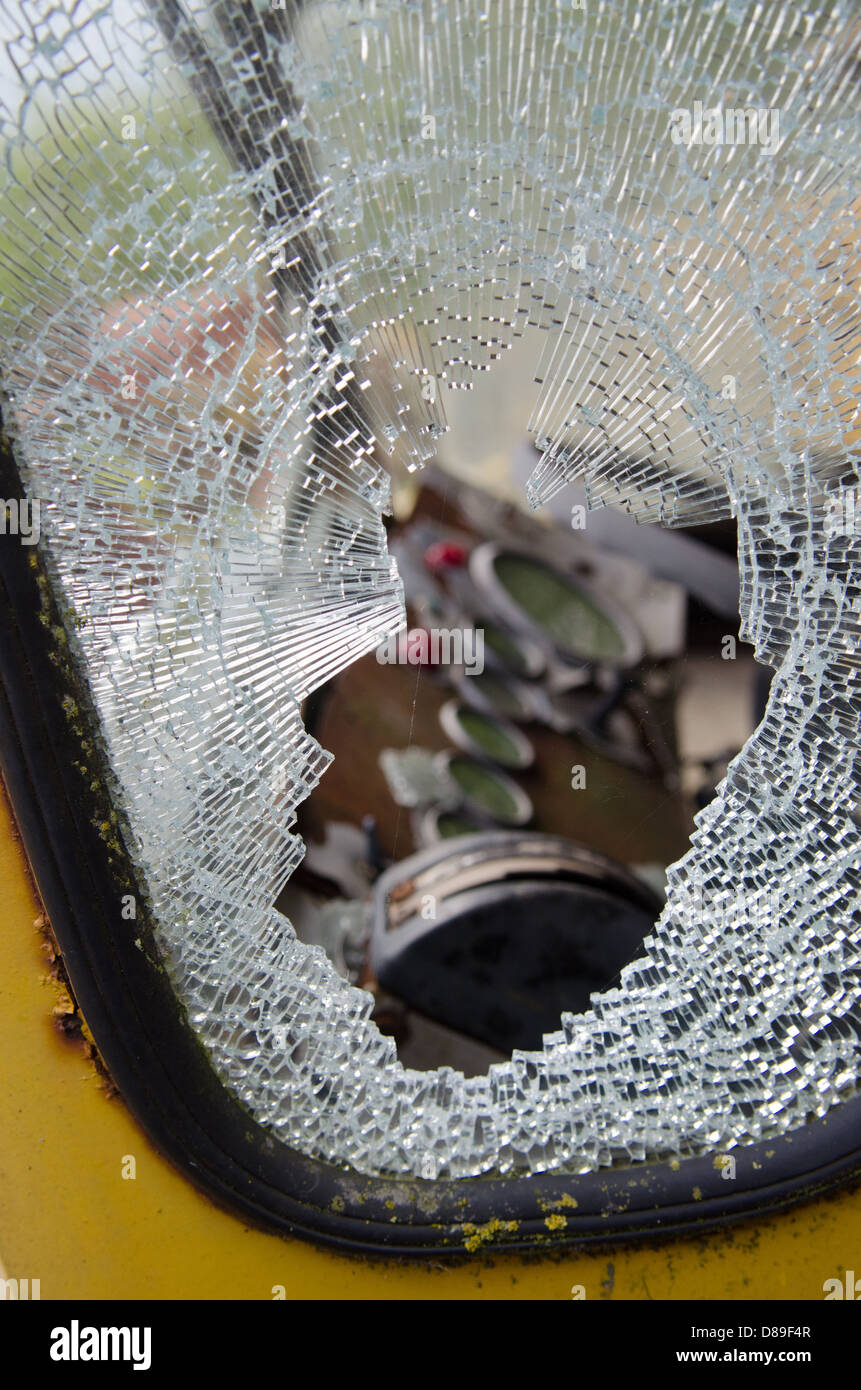 Smashed window of a work vehicle Stock Photo - Alamy