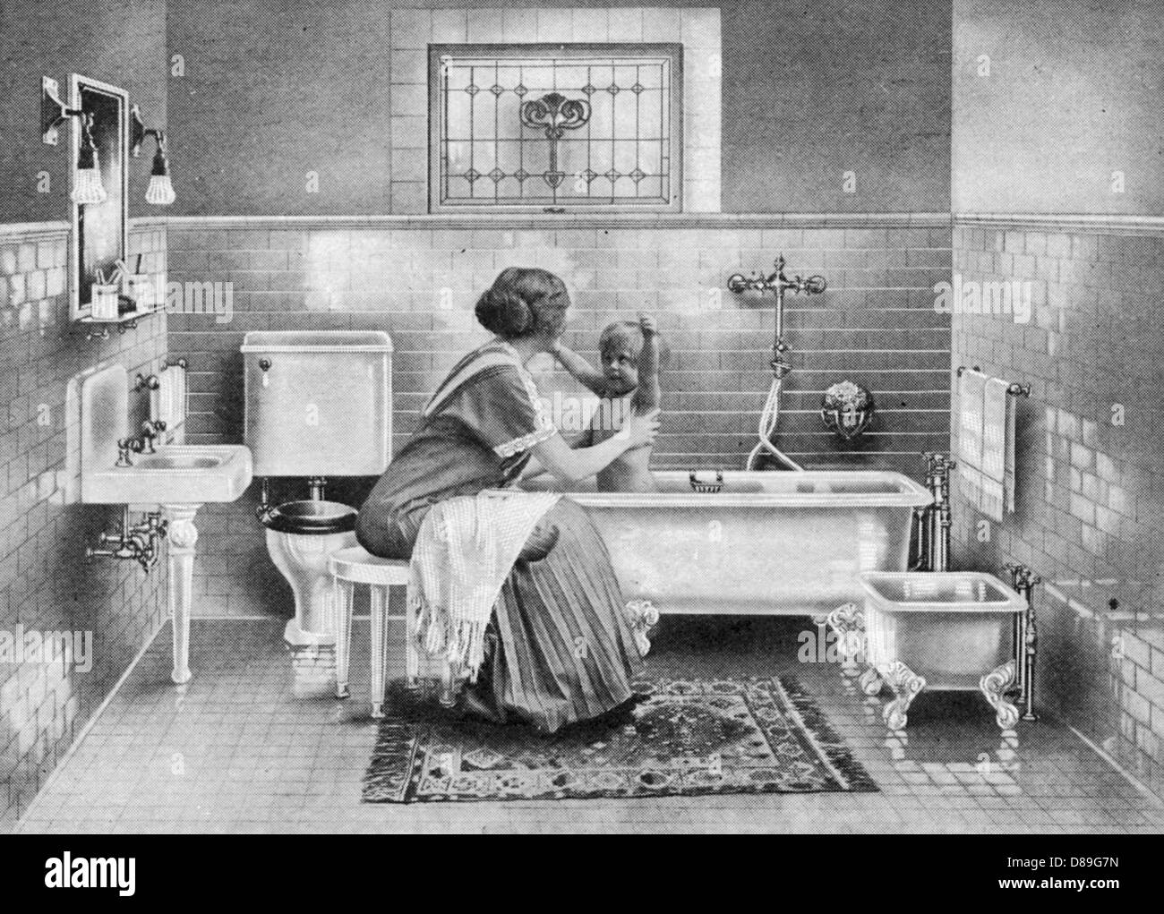 BABY'S BATHTIME 1912 Stock Photo - Alamy