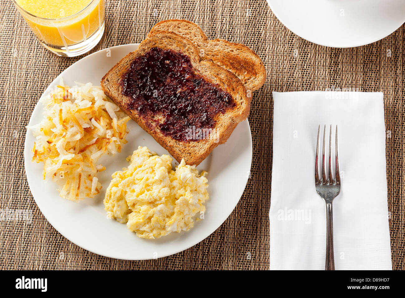 Homemade Wholesome American Breakfast with eggs, toast, and hashbrowns ...
