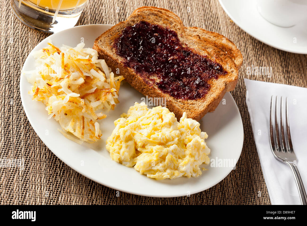 Homemade Wholesome American Breakfast with eggs, toast, and hashbrowns ...