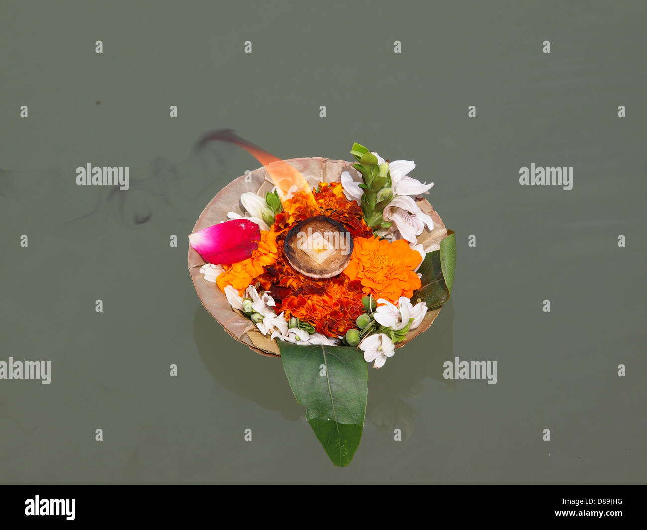 flowers and candles on the ganga river Stock Photo - Alamy