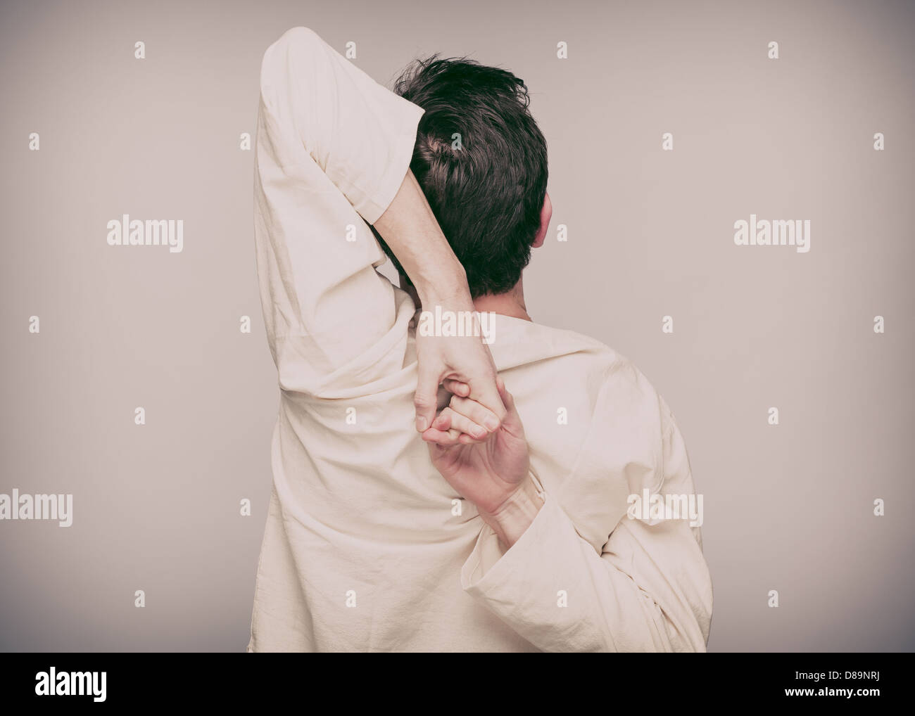 Arms behind back hi-res stock photography and images - Alamy