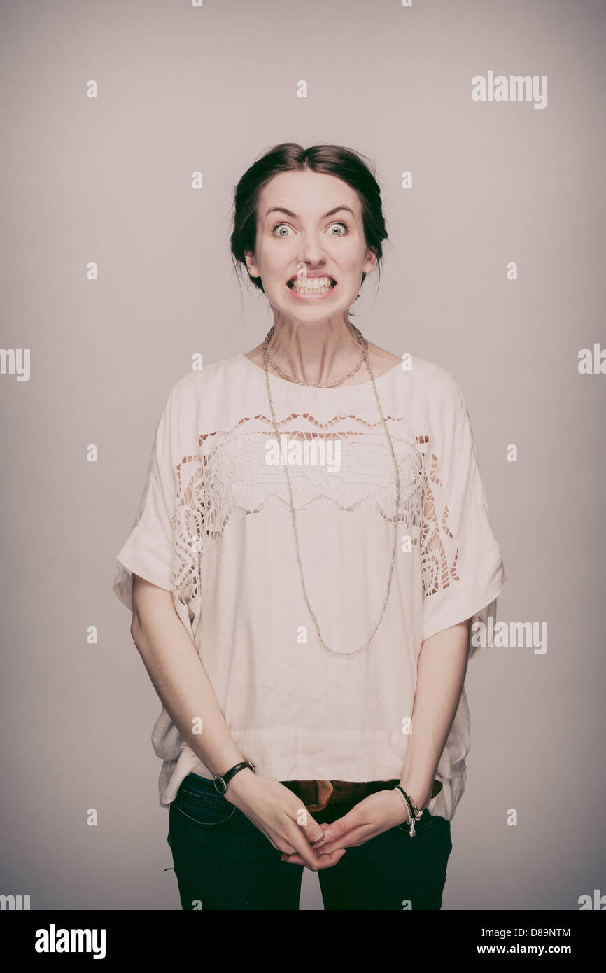 Maniacally grinning woman Stock Photo - Alamy