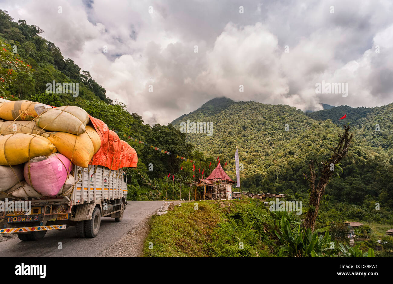 Overloaded lorry makes the arduous journey from Assam to Tawang along ...