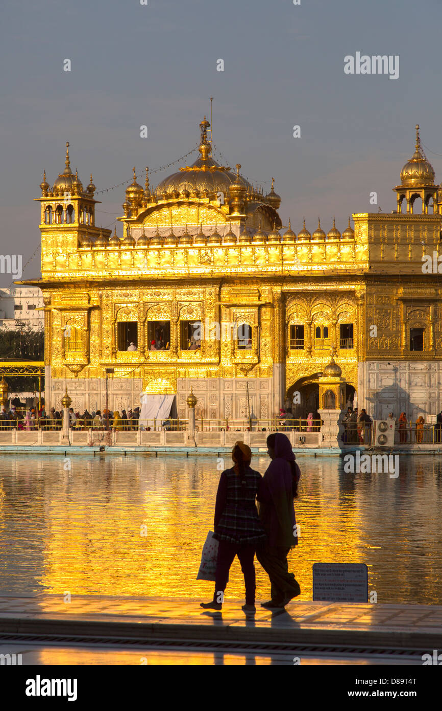 India, Punjab, Amritsar, Golden Temple, Sikh girls looking at temple ...