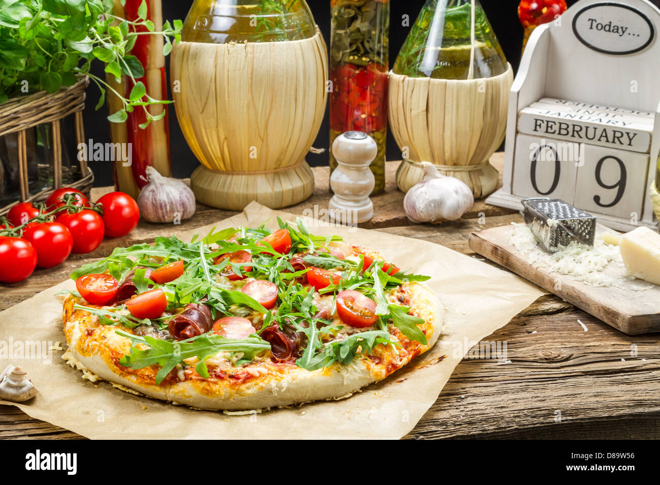 Preparing homemade pizza with ham Stock Photo - Alamy