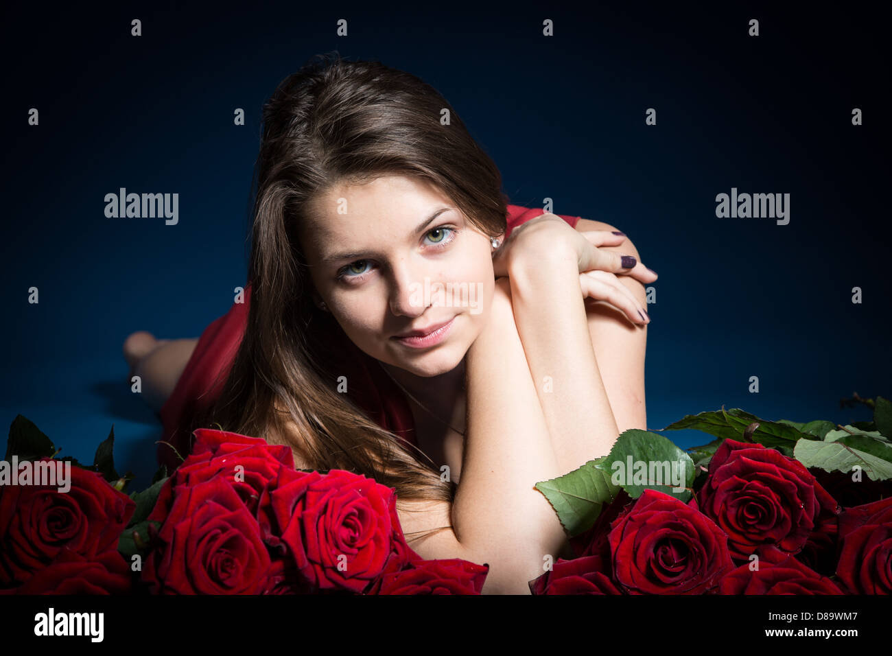 Beautiful girl with roses Stock Photo - Alamy