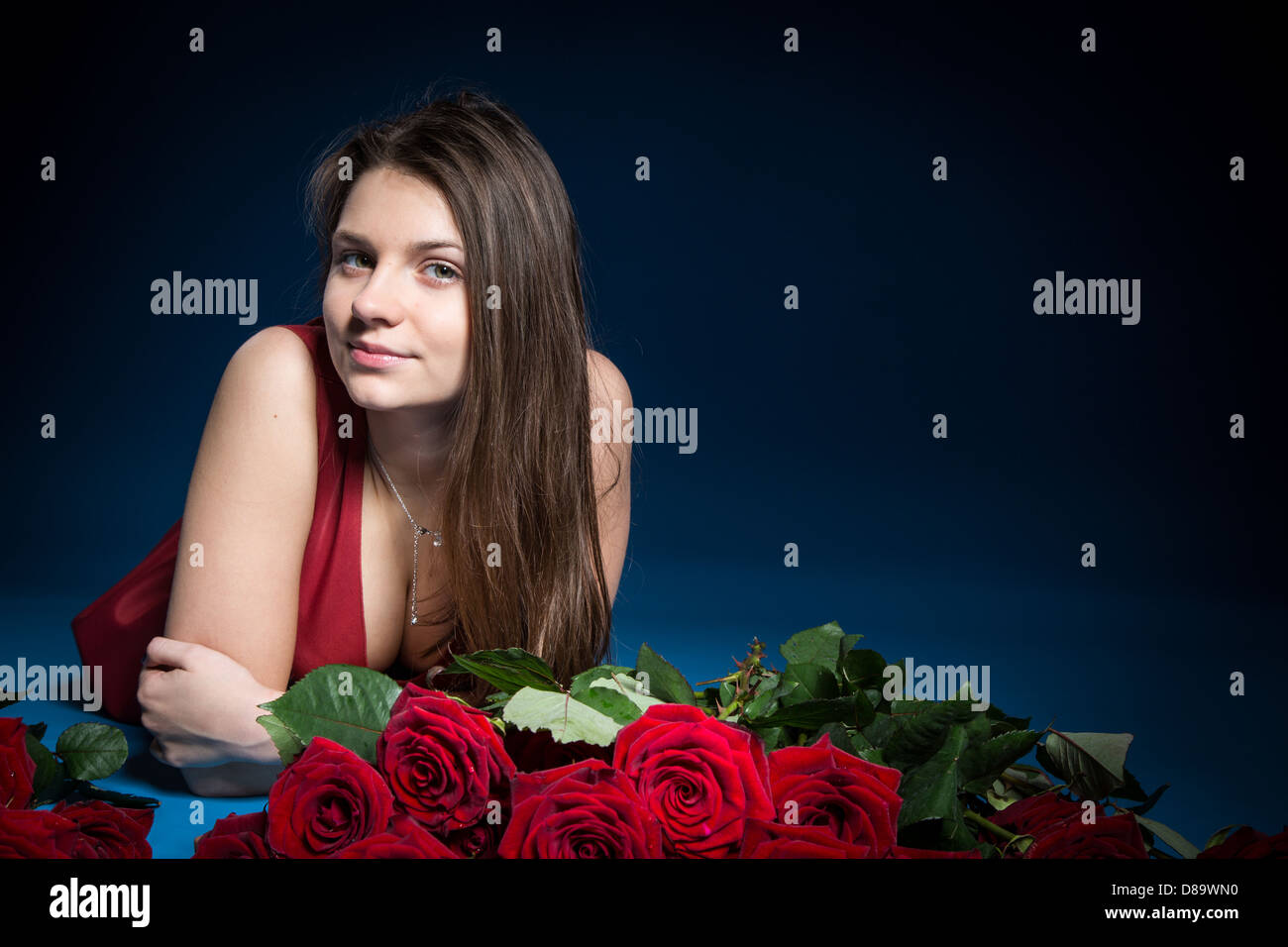 Beautiful girl with roses Stock Photo - Alamy