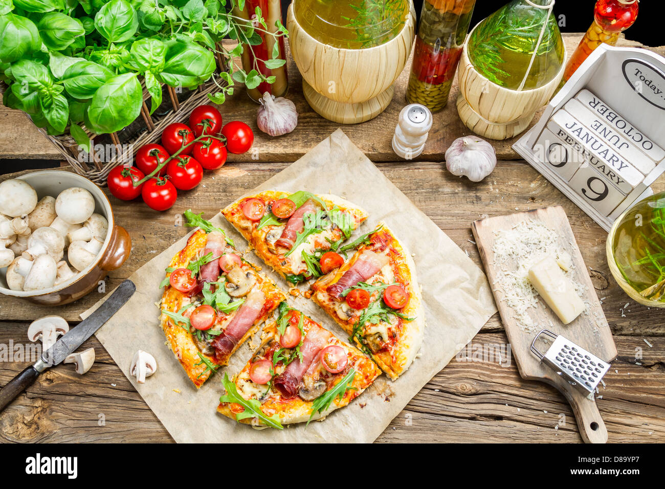 Split baked pizza with fresh vegetables Stock Photo - Alamy