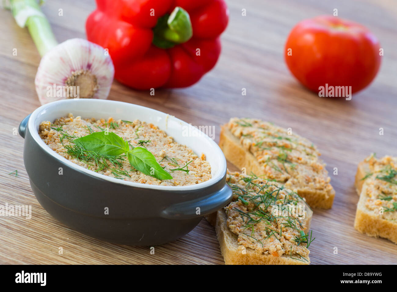 fresh homemade meat paste in a bowl and herbs Stock Photo - Alamy
