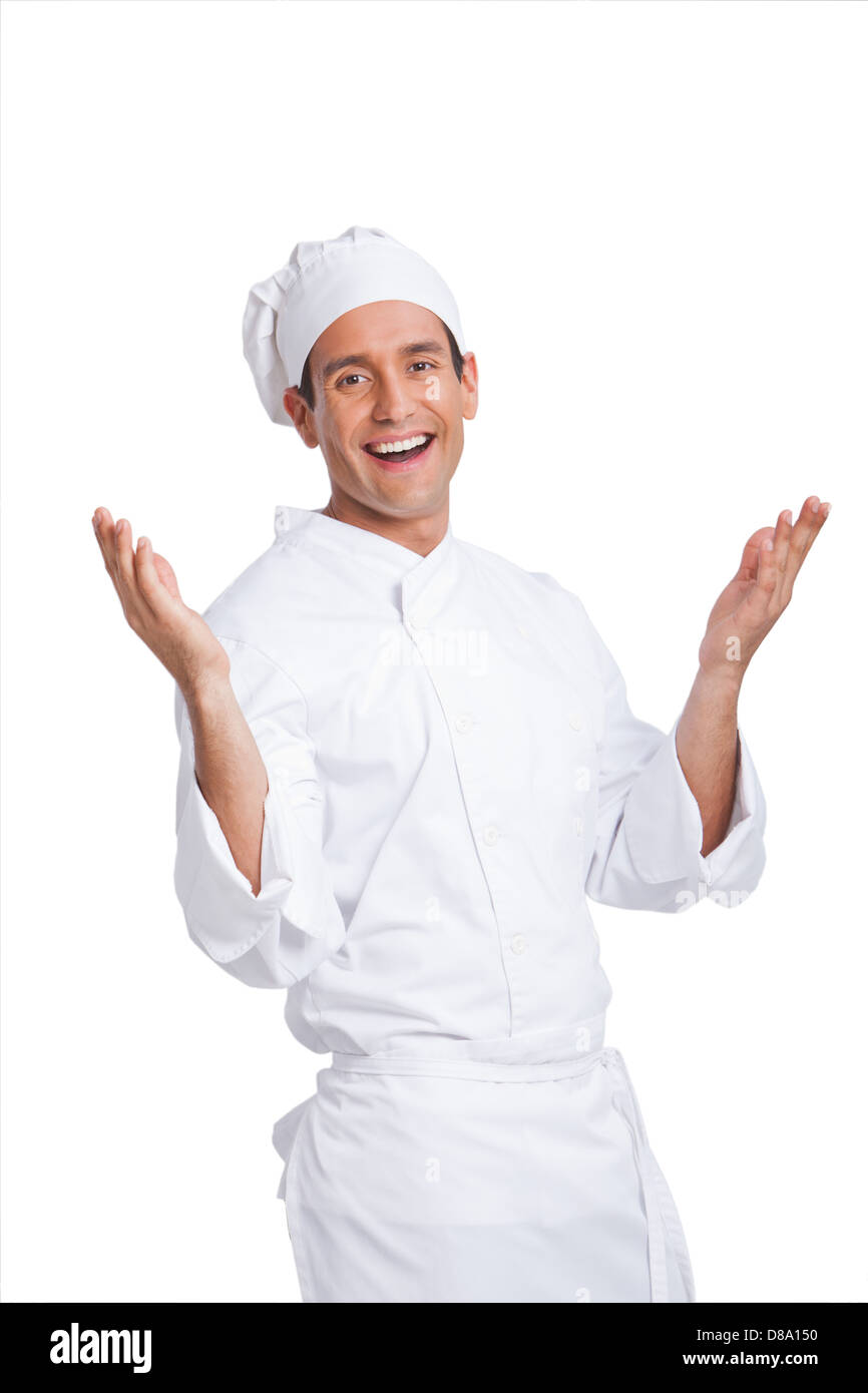 Male chef smiling and making hand gesturing isolated on white Stock ...