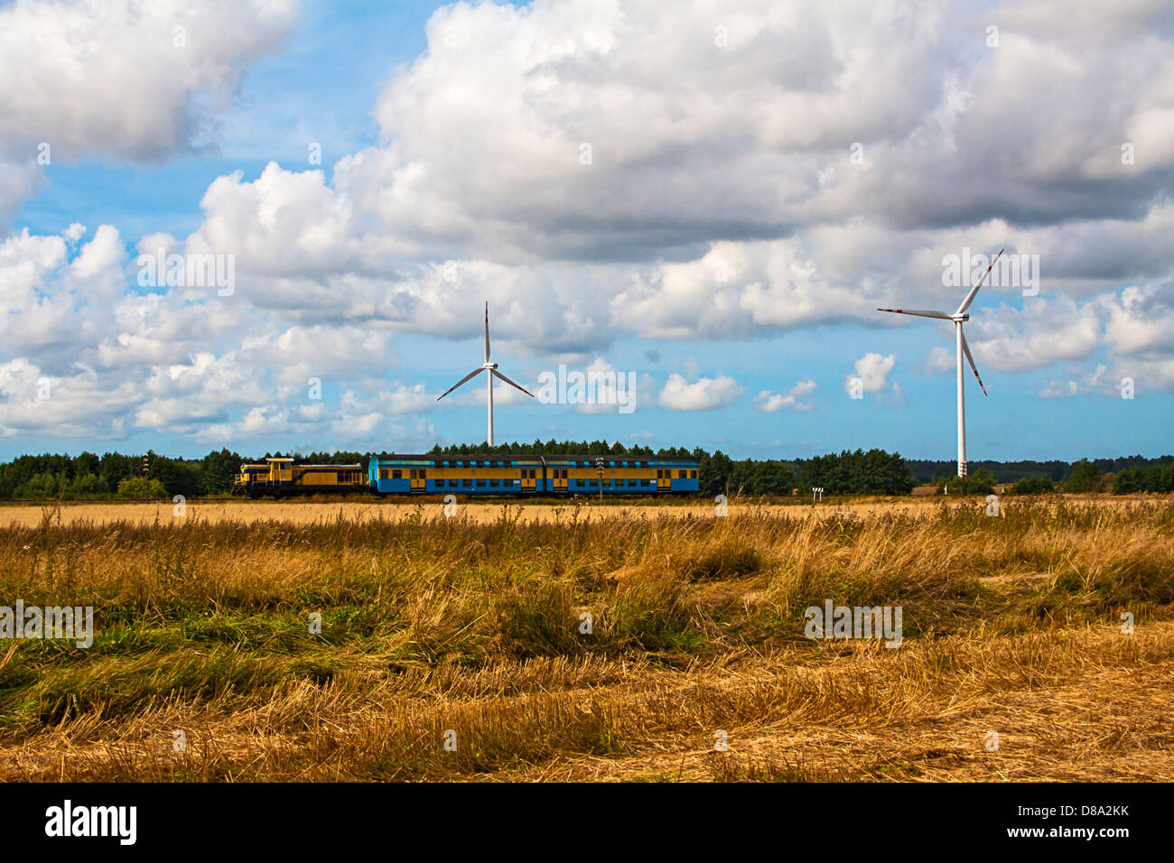 Summer landscape with energy wind turbines farm Stock Photo - Alamy