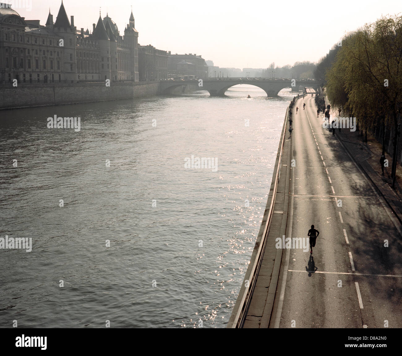 A runner along the Seine river in Paris, France Stock Photo - Alamy