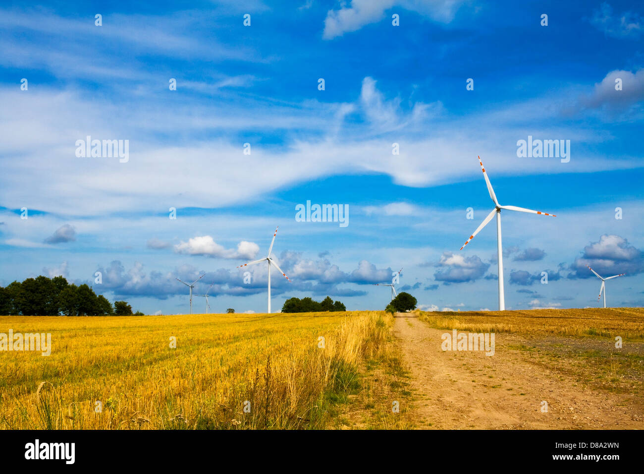 Summer landscape with energy wind turbines farm Stock Photo - Alamy
