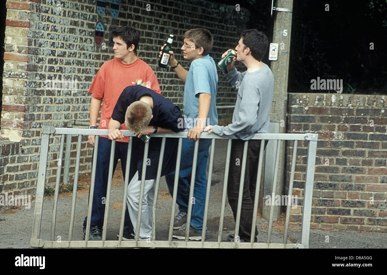 group of boys drinking alcohol in street Stock Photo - Alamy