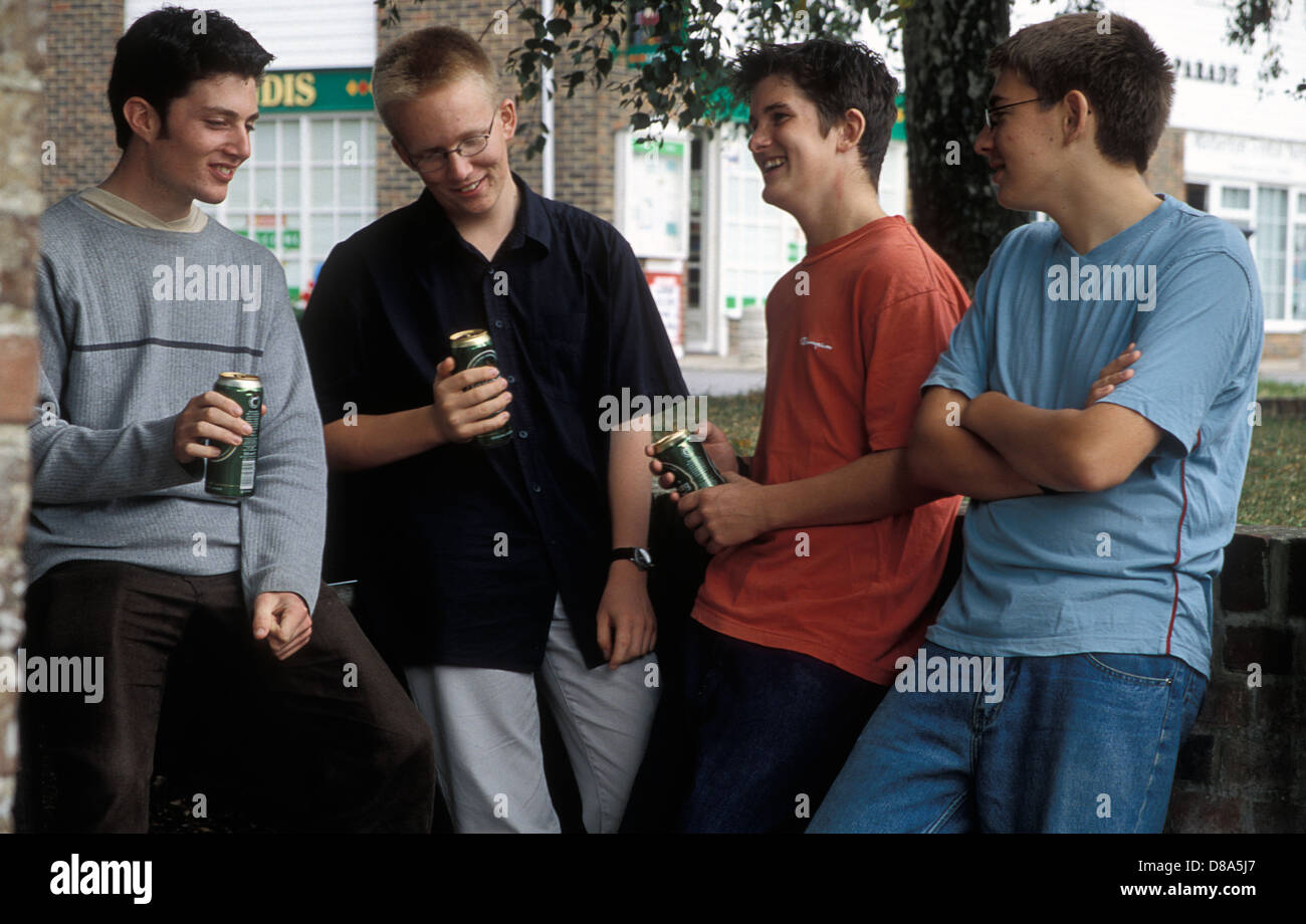 group of teenage boys drinking alcohol in street Stock Photo - Alamy