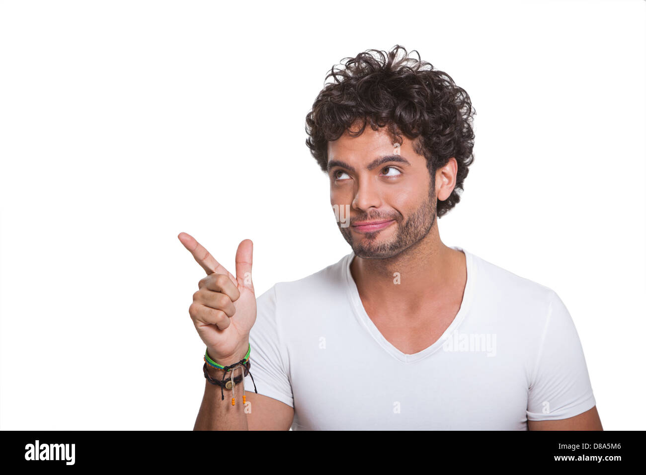 Young man pointing out with finger on white background Stock Photo - Alamy