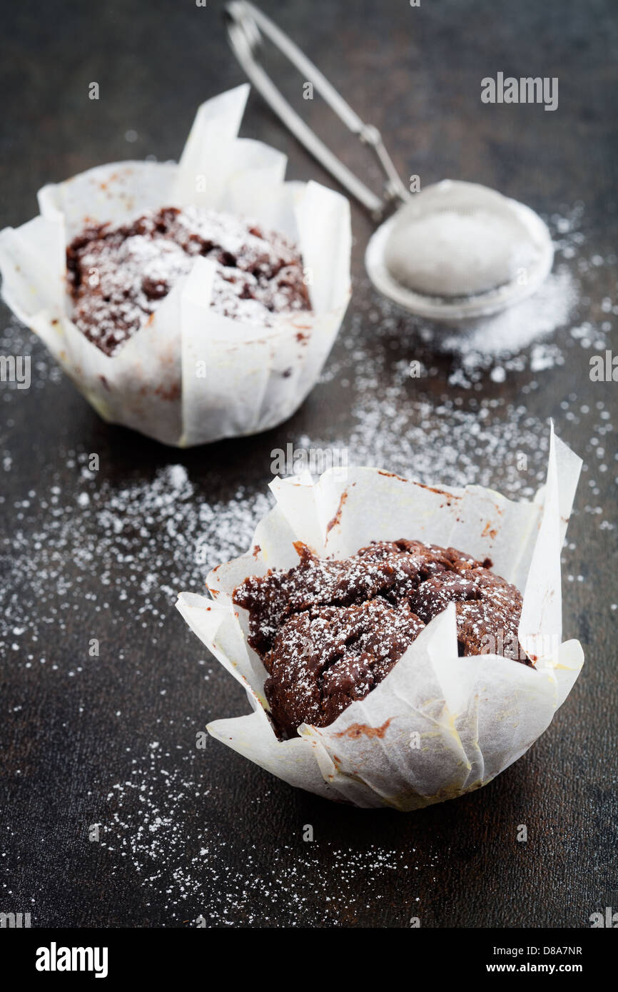 Fresh homemade chocolate muffins with powder sugar Stock Photo - Alamy