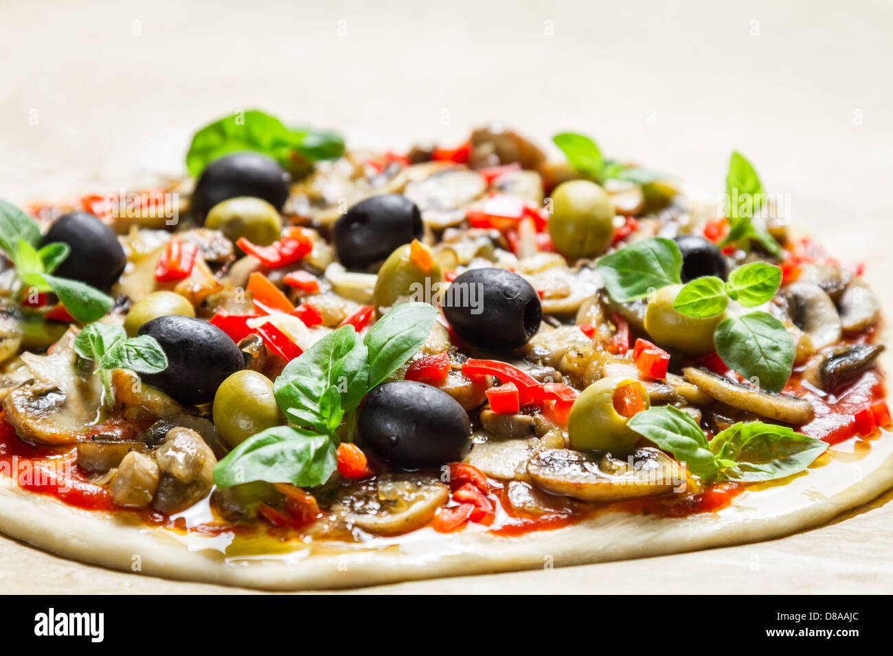 Prepared pizza before baking Stock Photo - Alamy