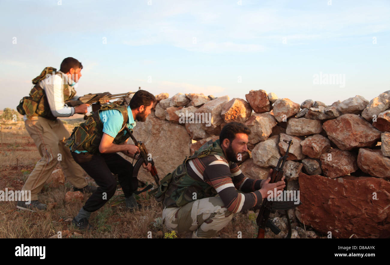 Aleppo, Syria. 22nd May 2013. Syrian rebels firing AK-47 machine guns ...