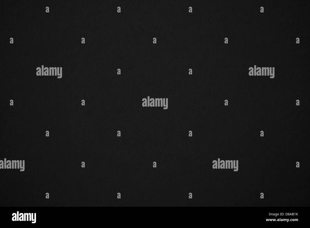 This image showcases the texture of black paper, with a smooth, matte ...