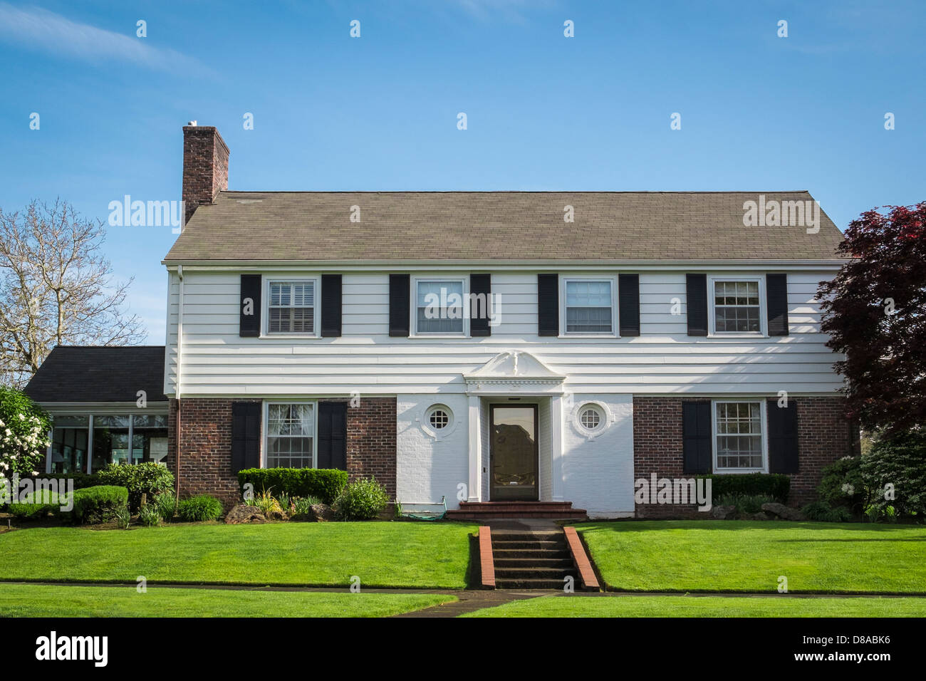 Classic American suburban house with blue sky background Stock Photo ...