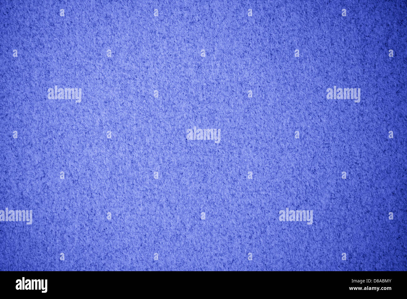 A close-up image of blue speckled paper texture, showing a unique ...