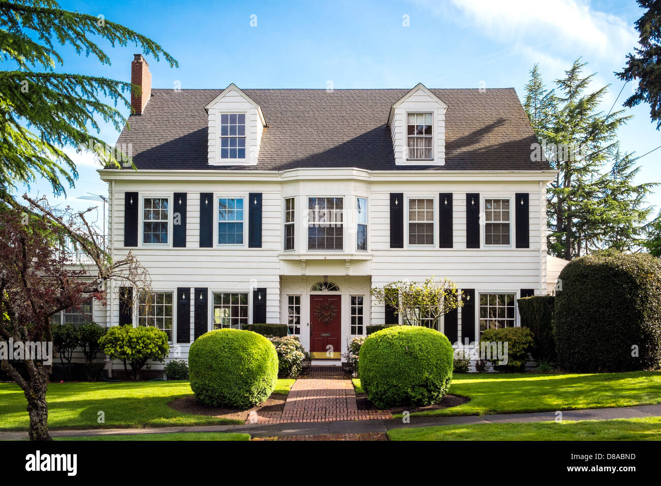 Classic American suburban house with blue sky background Stock Photo ...