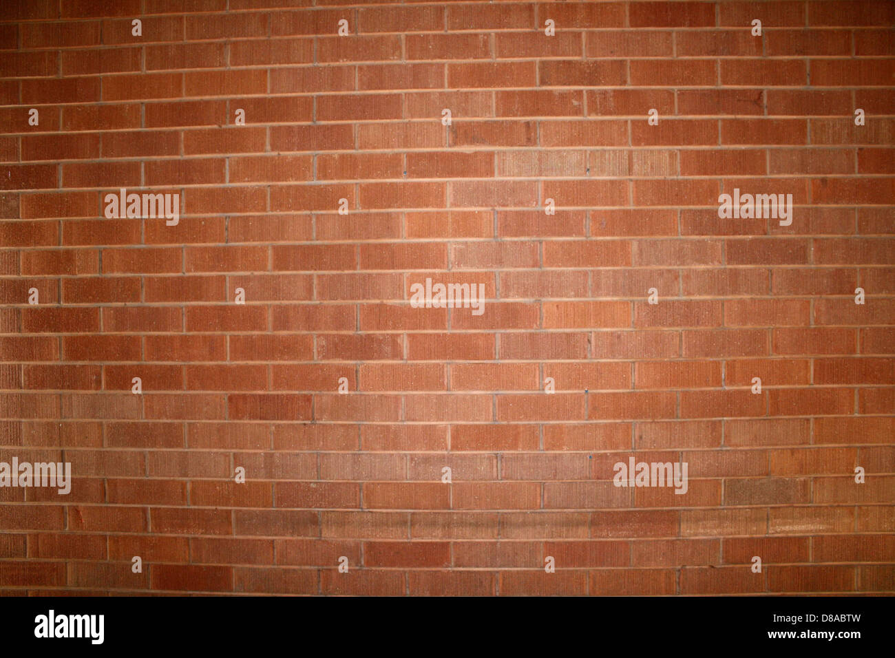 Close-up of a brick wall showcasing its texture. The rough surface and ...